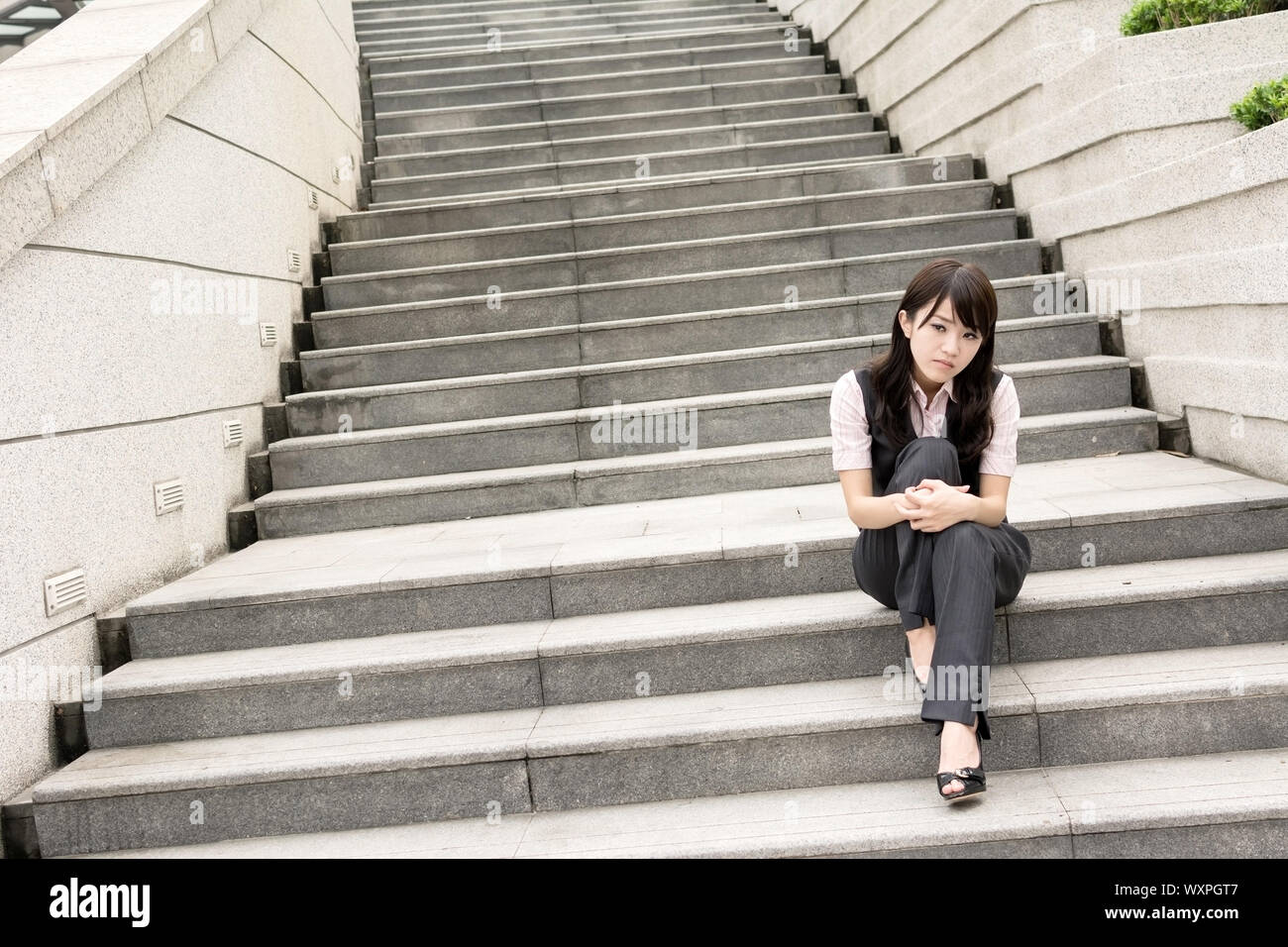 Sad business woman feel worried and stressed in outside of modern city ...