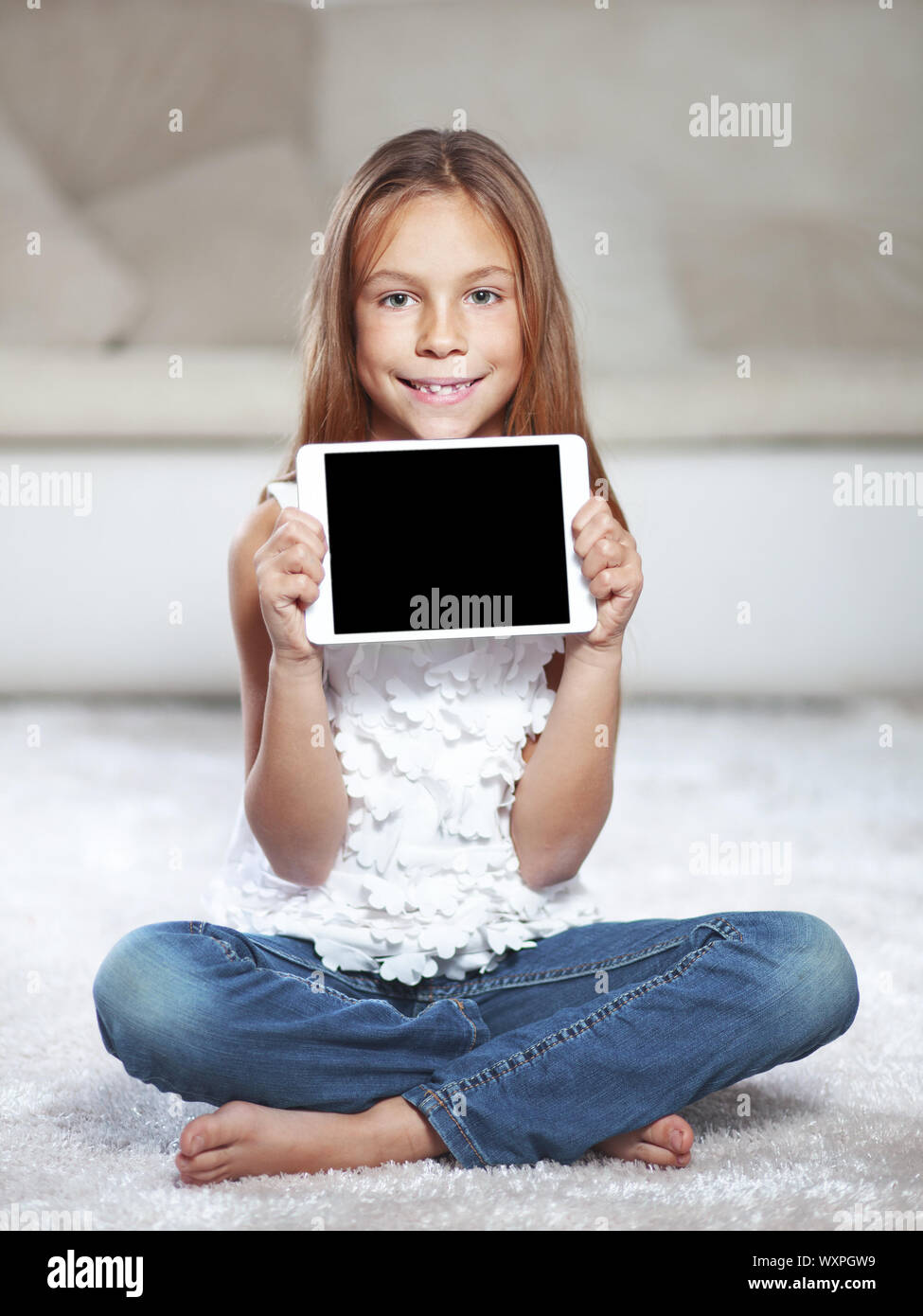 Child playing on tablet pc Stock Photo - Alamy