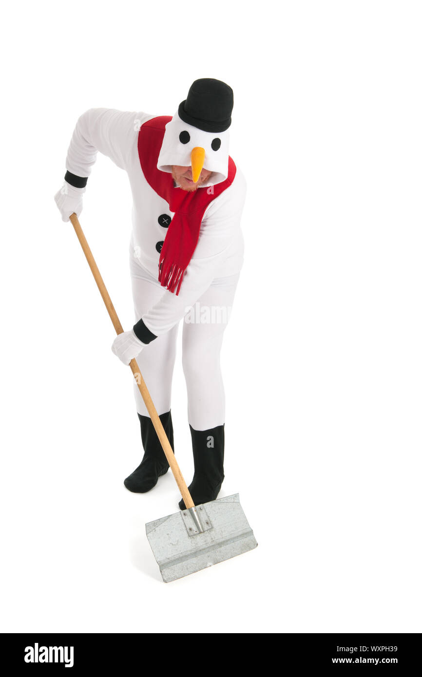 Human snowman is cleaning the street from snow Stock Photo - Alamy