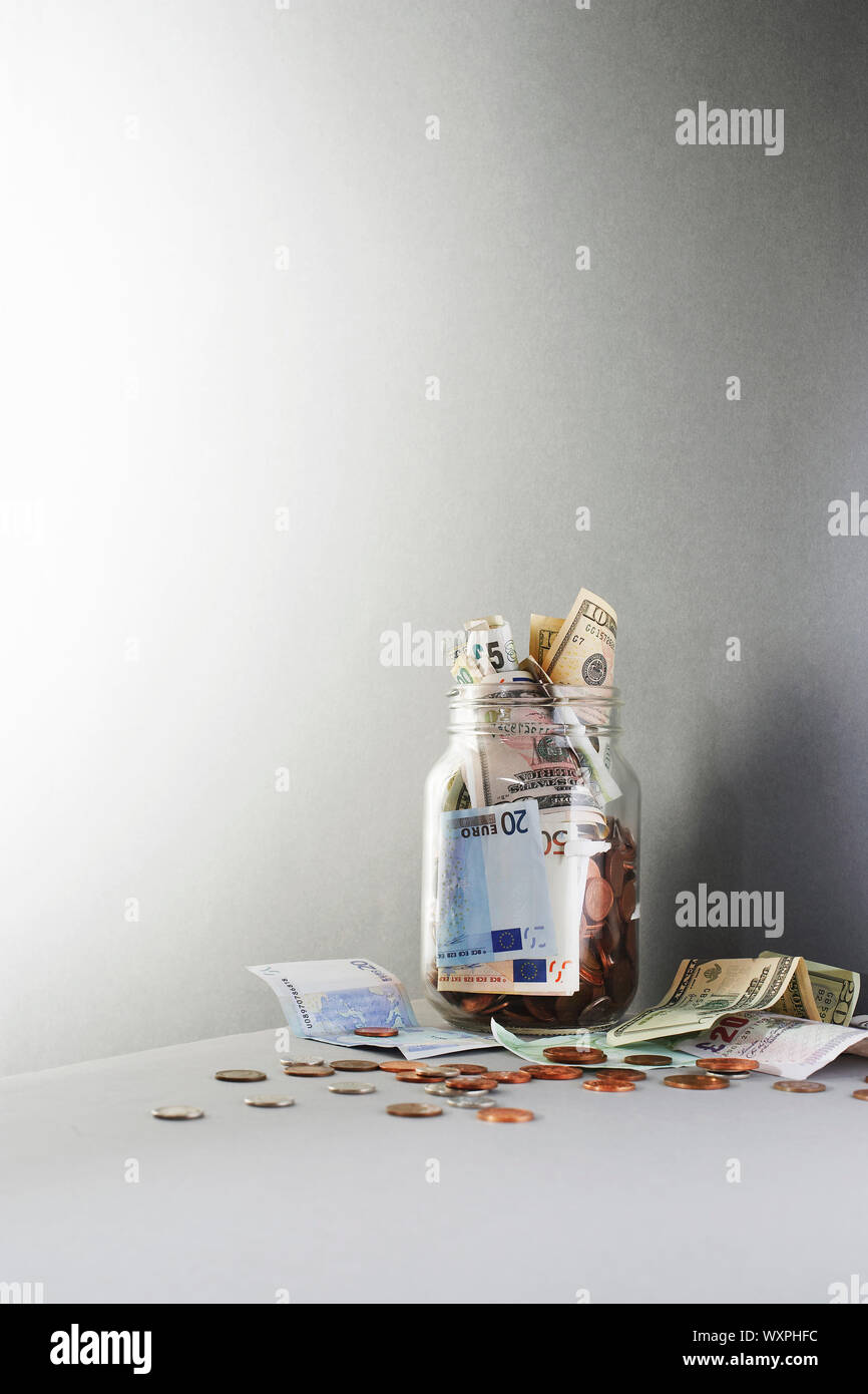 Full Money Jar Stock Photo - Alamy