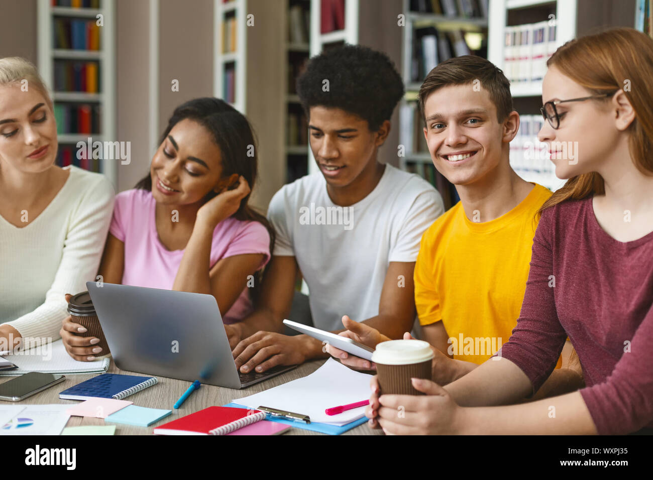 International students using laptop and tablet while studying Stock ...
