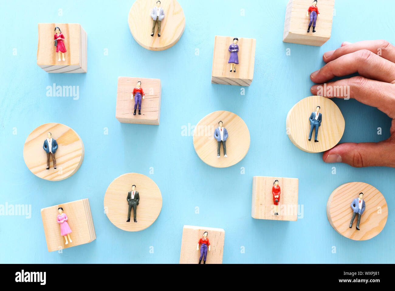 business concept image of people figures over wooden table, human ...