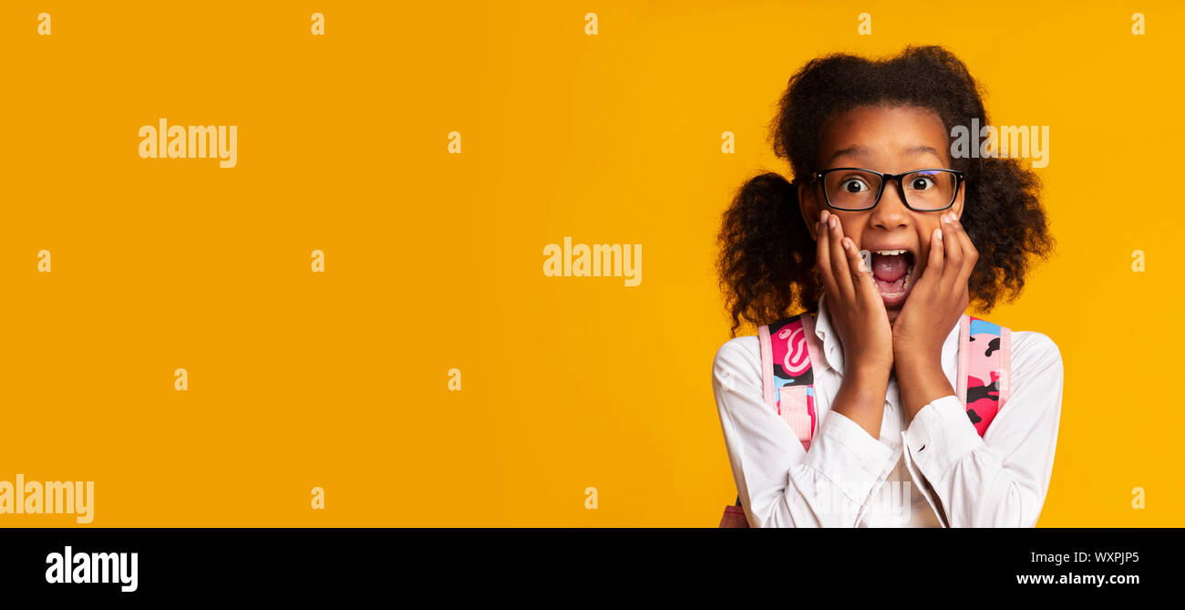 Scared African American Schoolgirl Shouting With Fear In Studio Stock ...