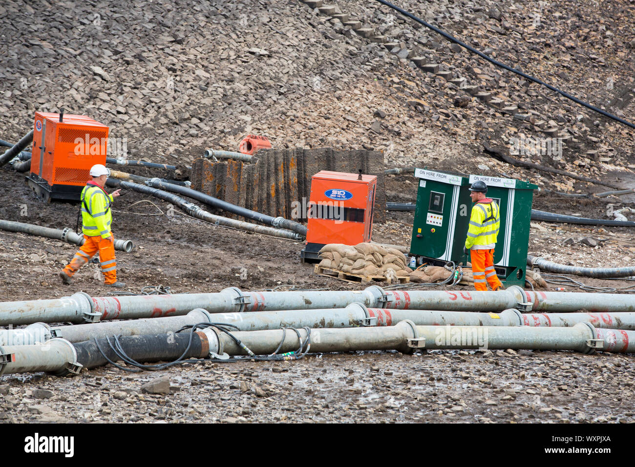 Pumping out water from Toddbrook Reservoir above Whaley Bridge in ...
