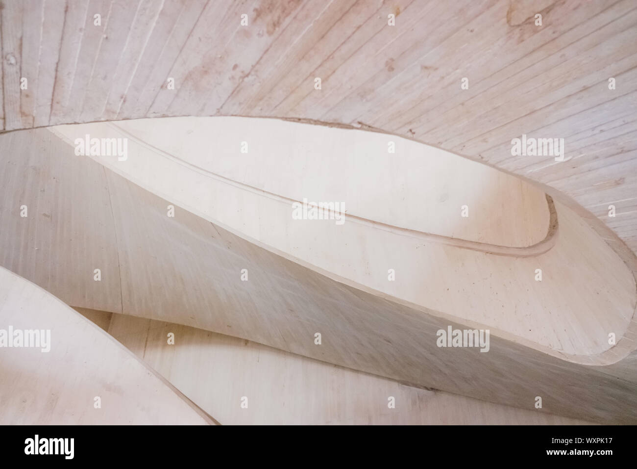 Curved lines bent on a solid background of light colors Stock Photo - Alamy