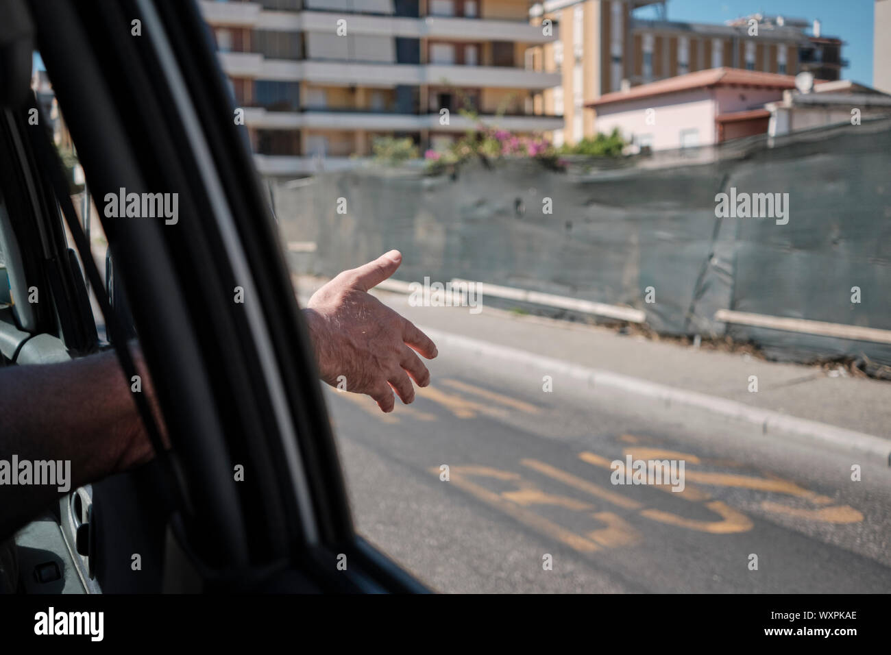 hand feeling air out of the window car Stock Photo - Alamy