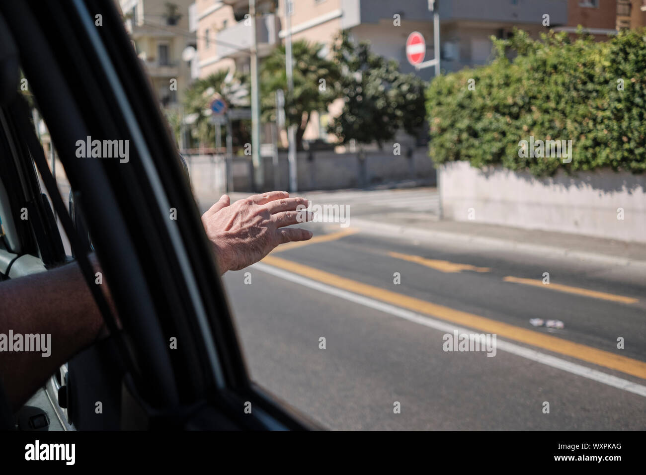 hand feeling air out of the window car Stock Photo - Alamy