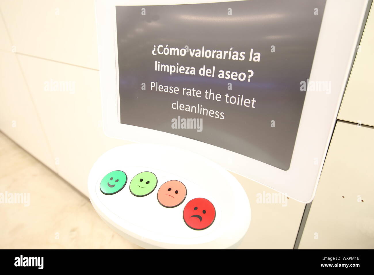 Cleanliness customer satisfaction button in Spain Stock Photo - Alamy