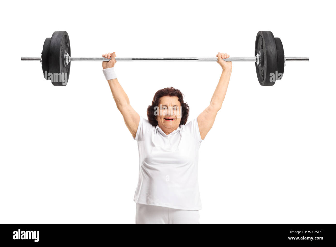 Strong elderly woman lifting a barbell isolated on white background ...