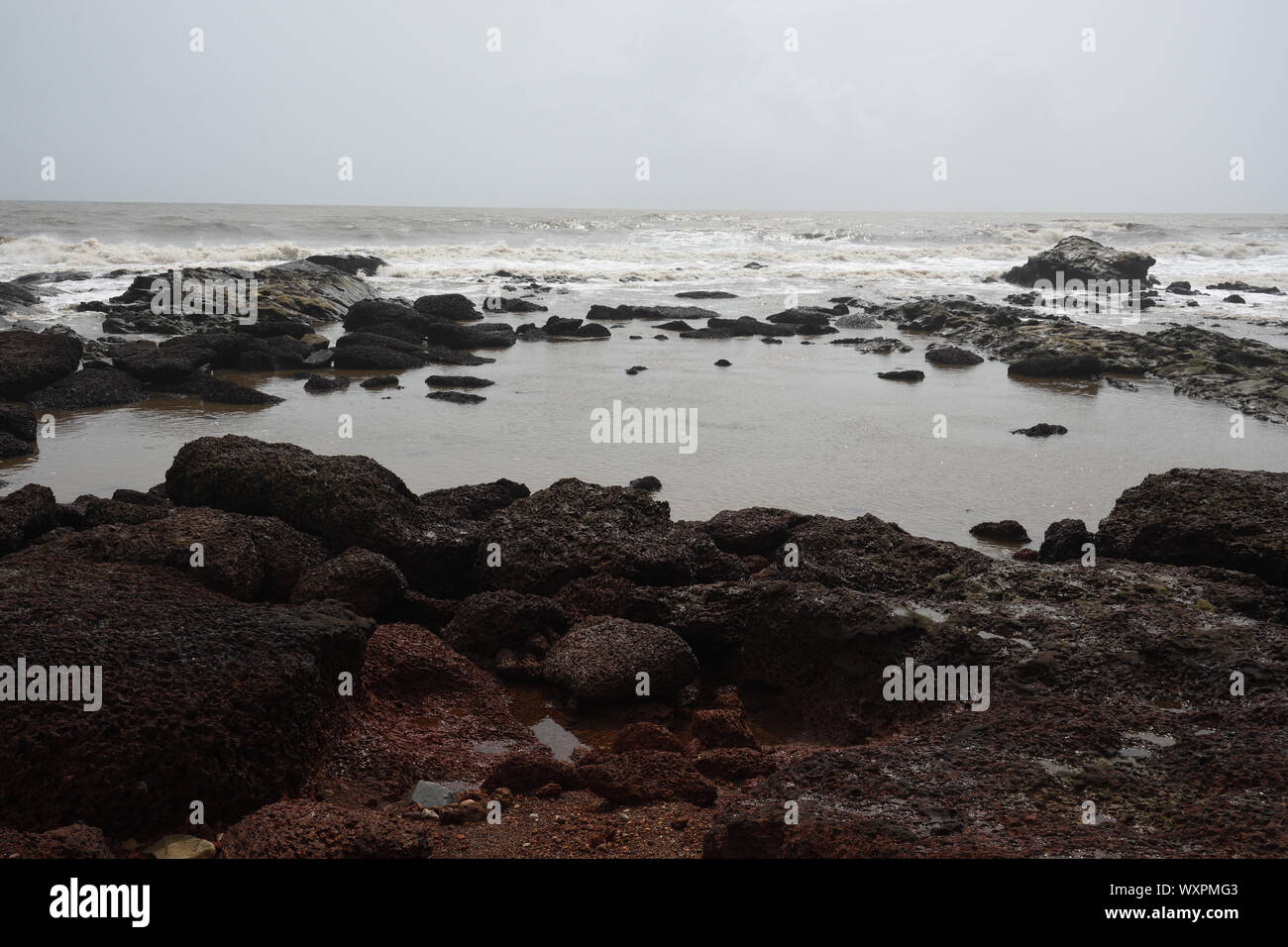 Coral reefs of the Anjuna beach. Goa, India Stock Photo - Alamy