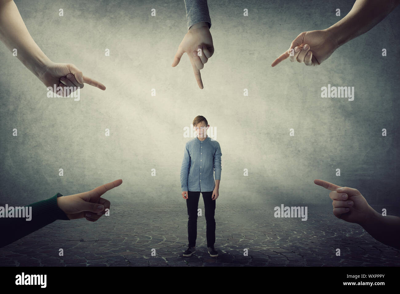 Stressed teen boy, under pressure, looking down feel ashamed and ...