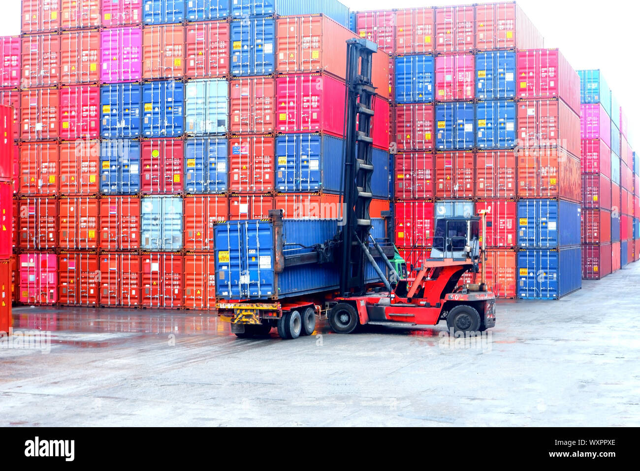Container handlers Down the truck for import and export Stock Photo - Alamy