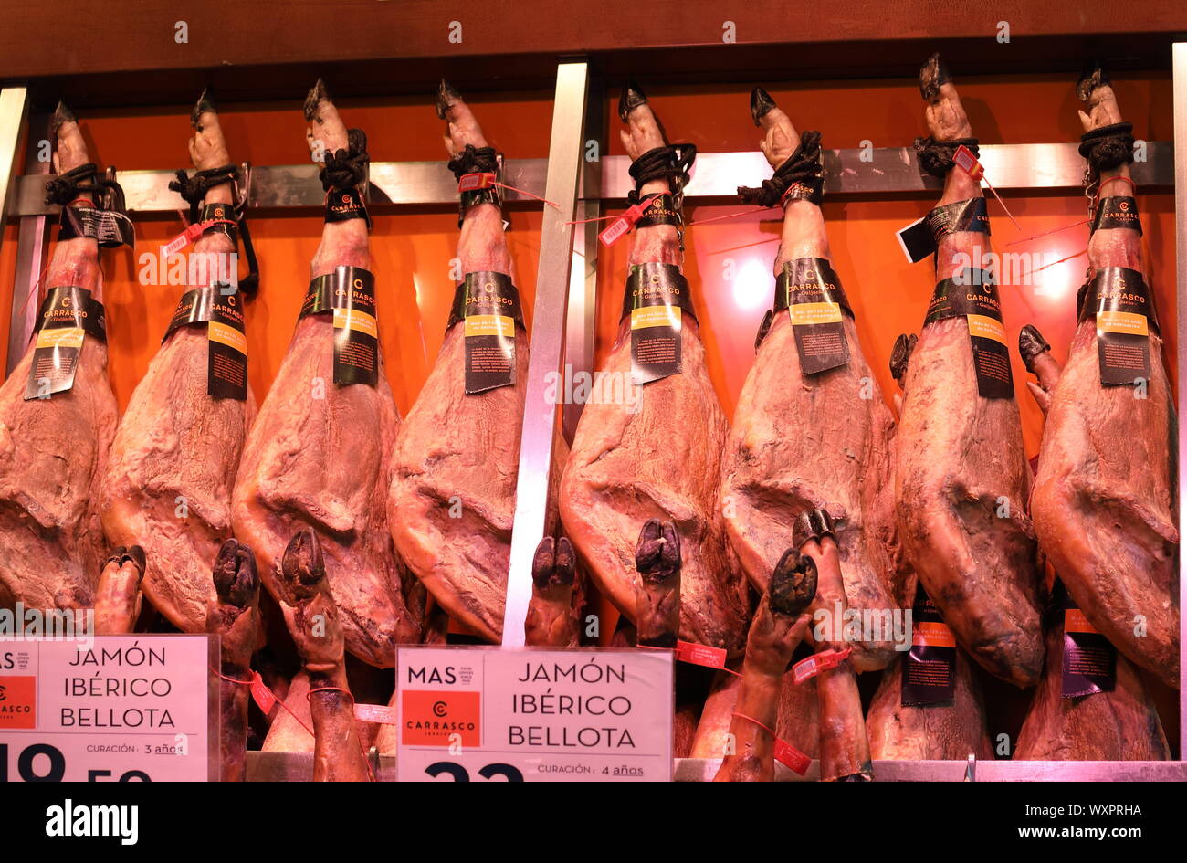 Spanish ham display at Mercado de San Miguel market Madrid Spain Stock ...