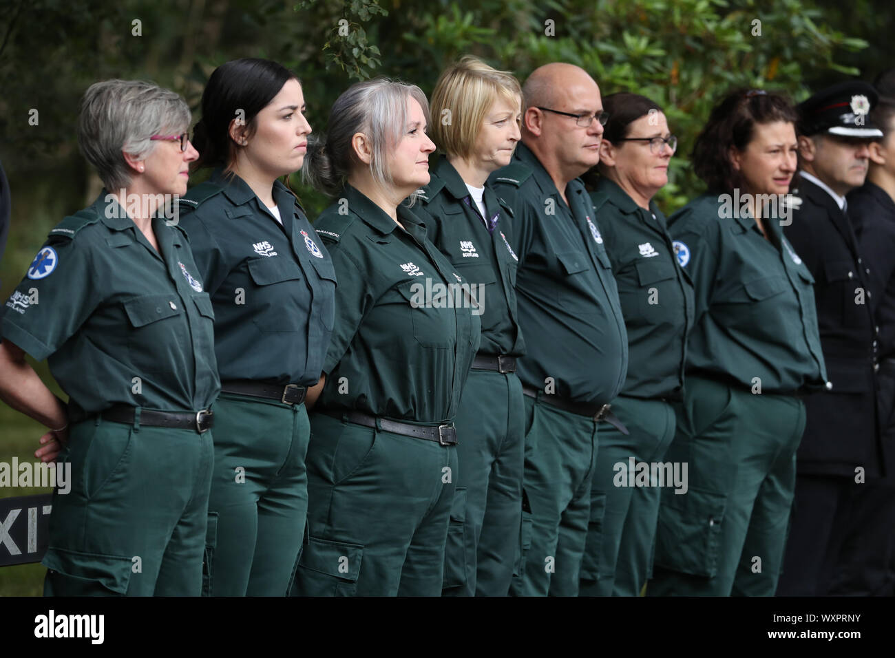 Police officers and other emergency services form a guard of honour, as ...