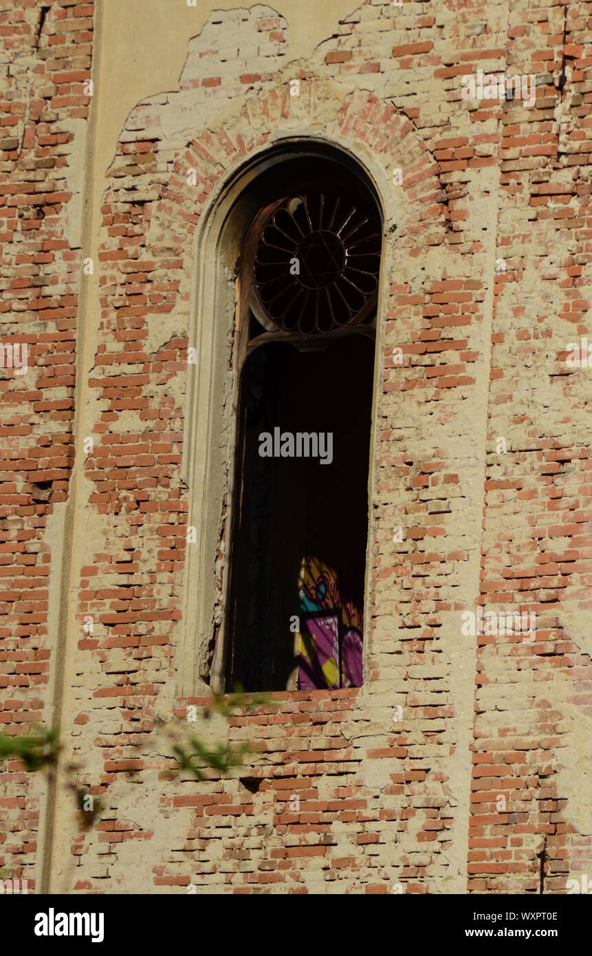 Graffiti art showing through broken windows and brickwork of Vidin ...