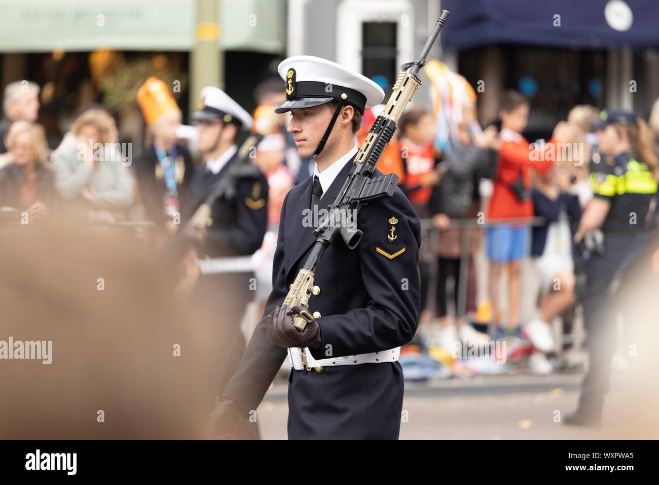 Military parade in traditional uniforms before the Dutch king and queen ...