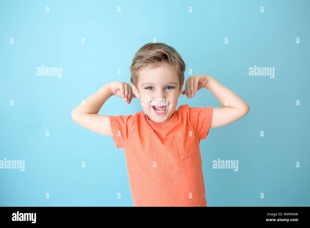 Little Boy Holding Ears Stock Photo - Alamy