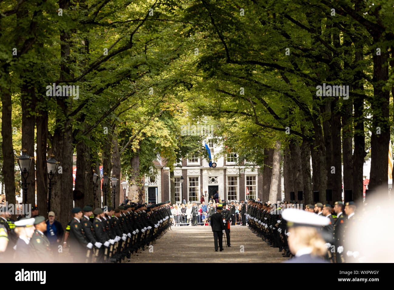 Military regiment in line waiting for the Dutch king and queen passing ...