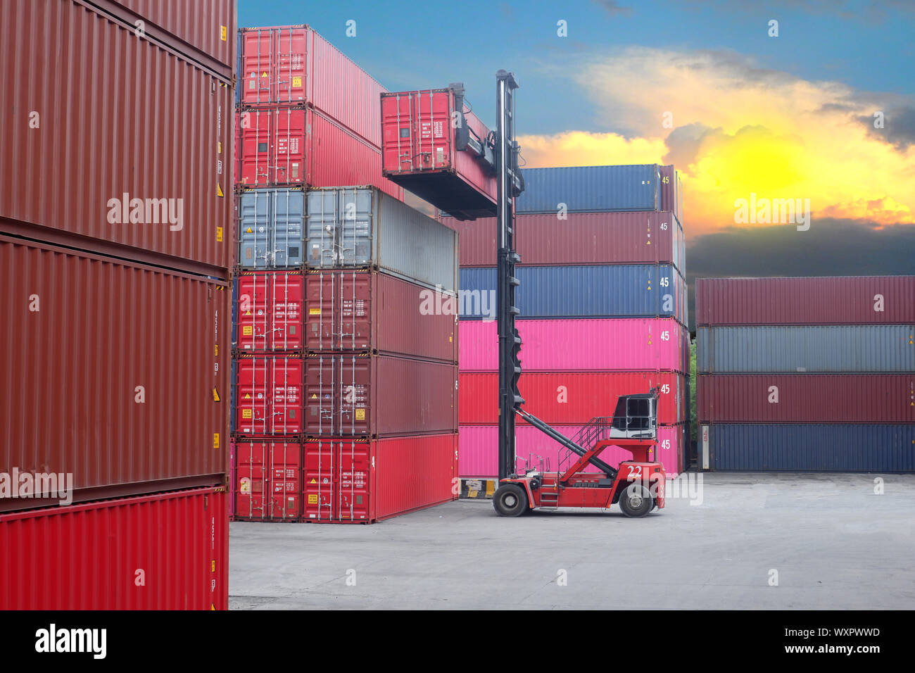 Forklift container loading and unloading cargo into the import-export ...