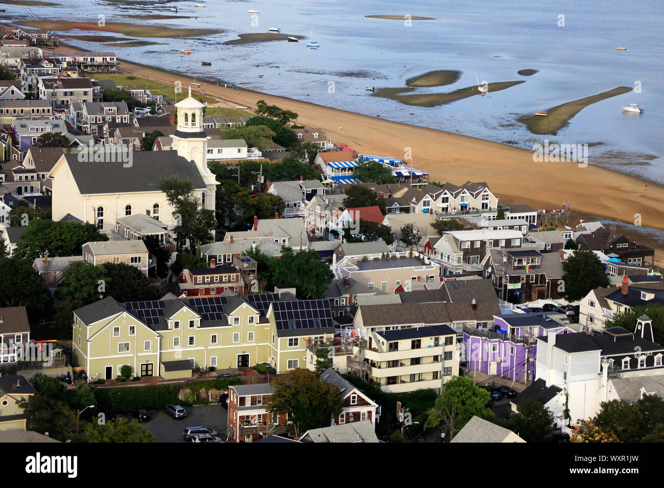 Aerial view of Provincetown and it;s beach coastline with tower of ...