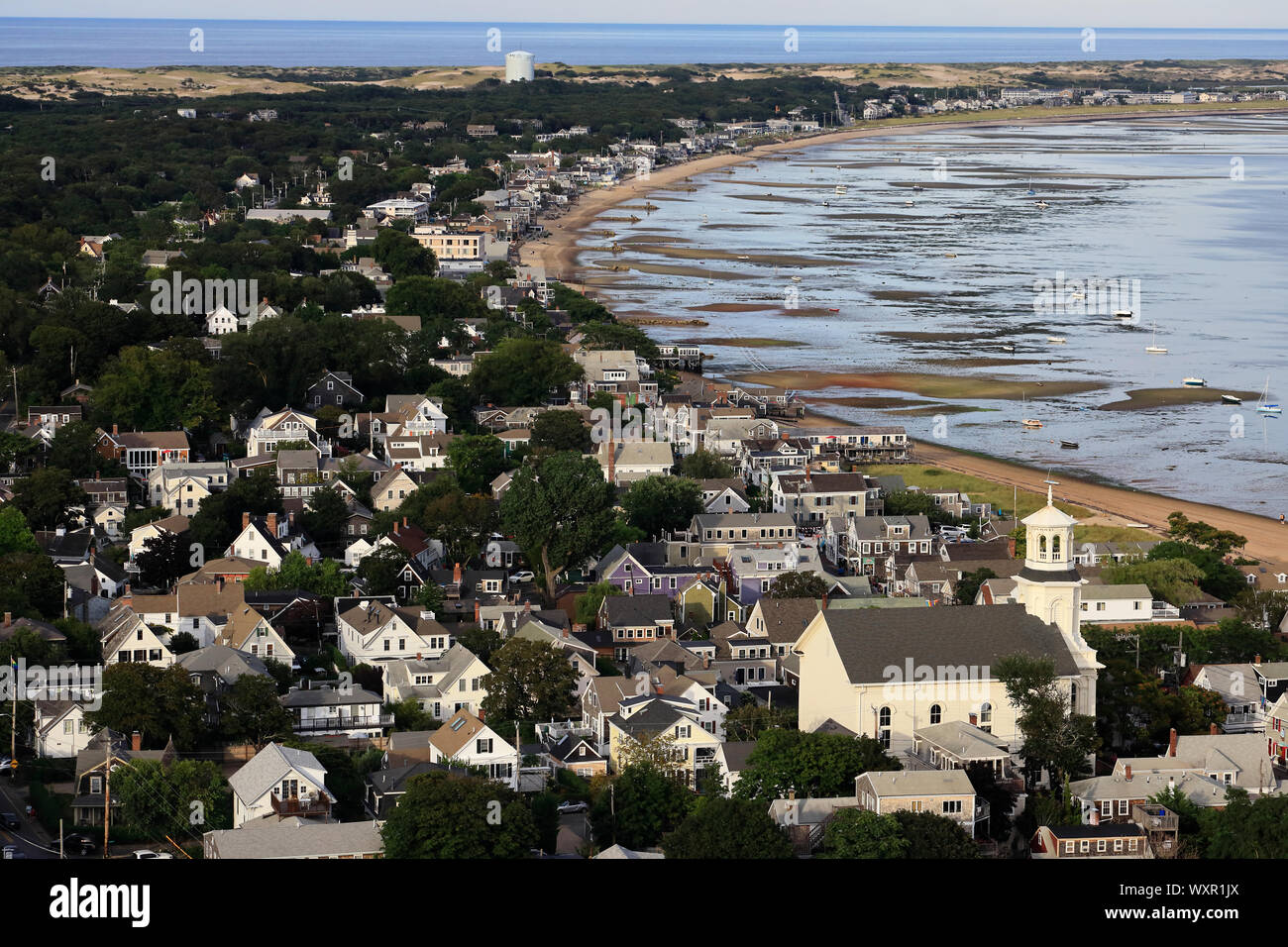 Aerial view of Provincetown and it;s beach coastline with tower of ...