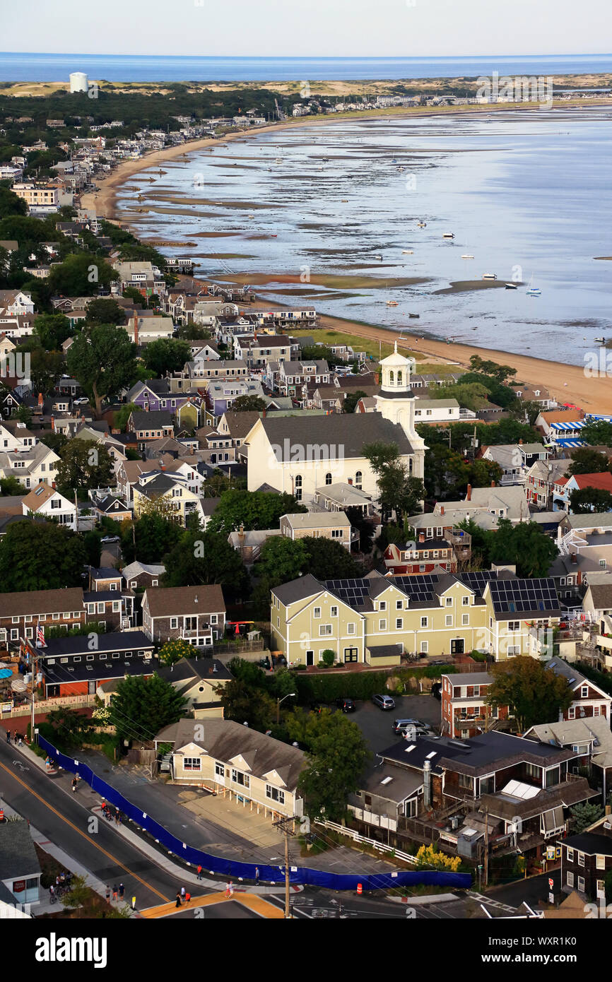 Aerial view of Provincetown and it;s beach coastline with tower of ...