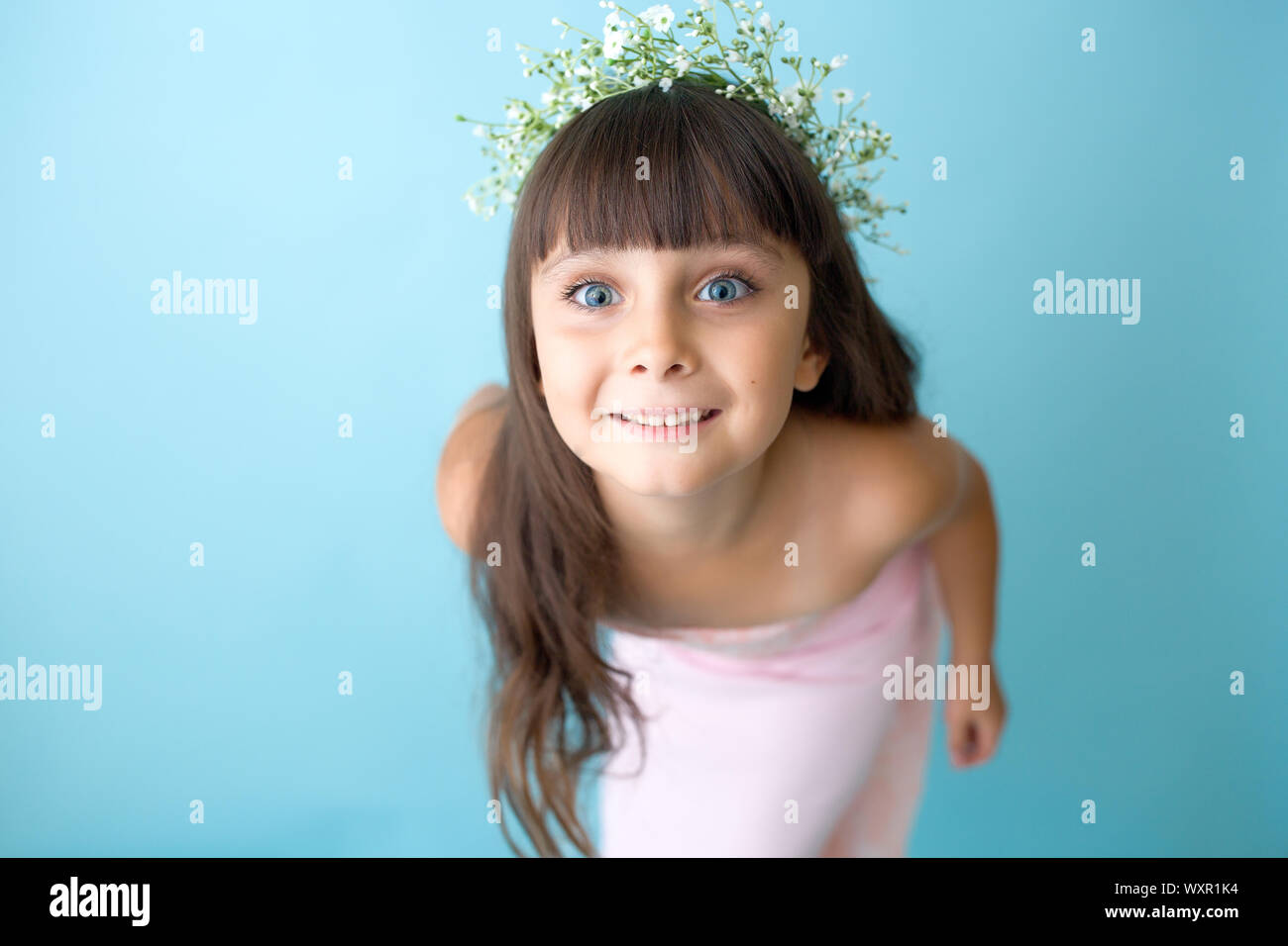 Girl leaning towards camera Stock Photo - Alamy