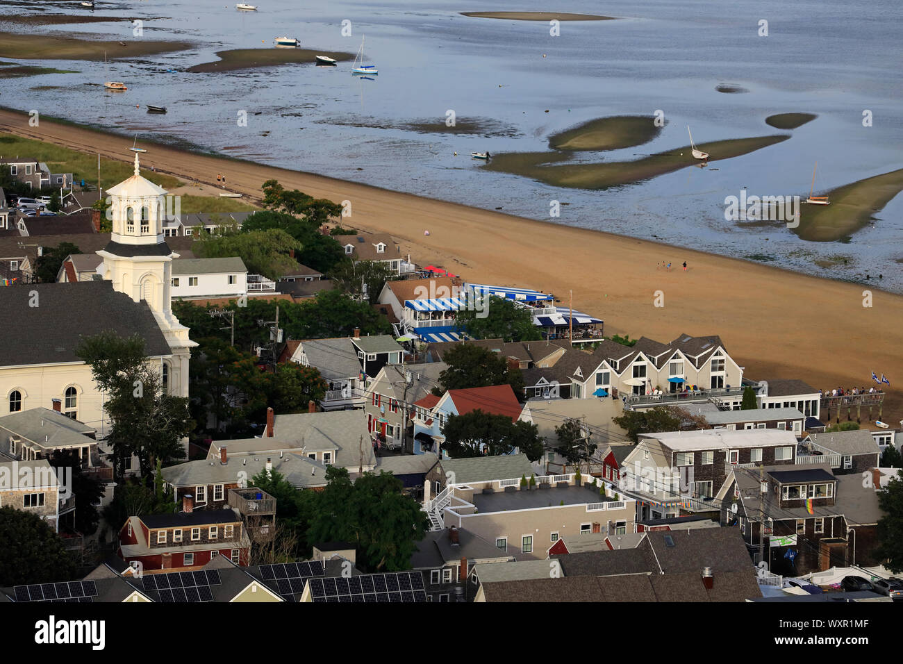 Aerial view of Provincetown and it;s beach coastline with tower of ...