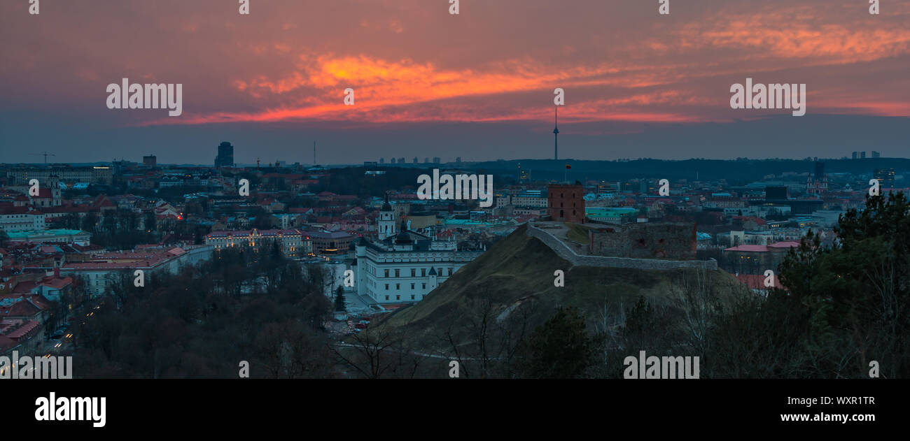 A picture of the sun setting over Vilnius, Lithuania Stock Photo - Alamy