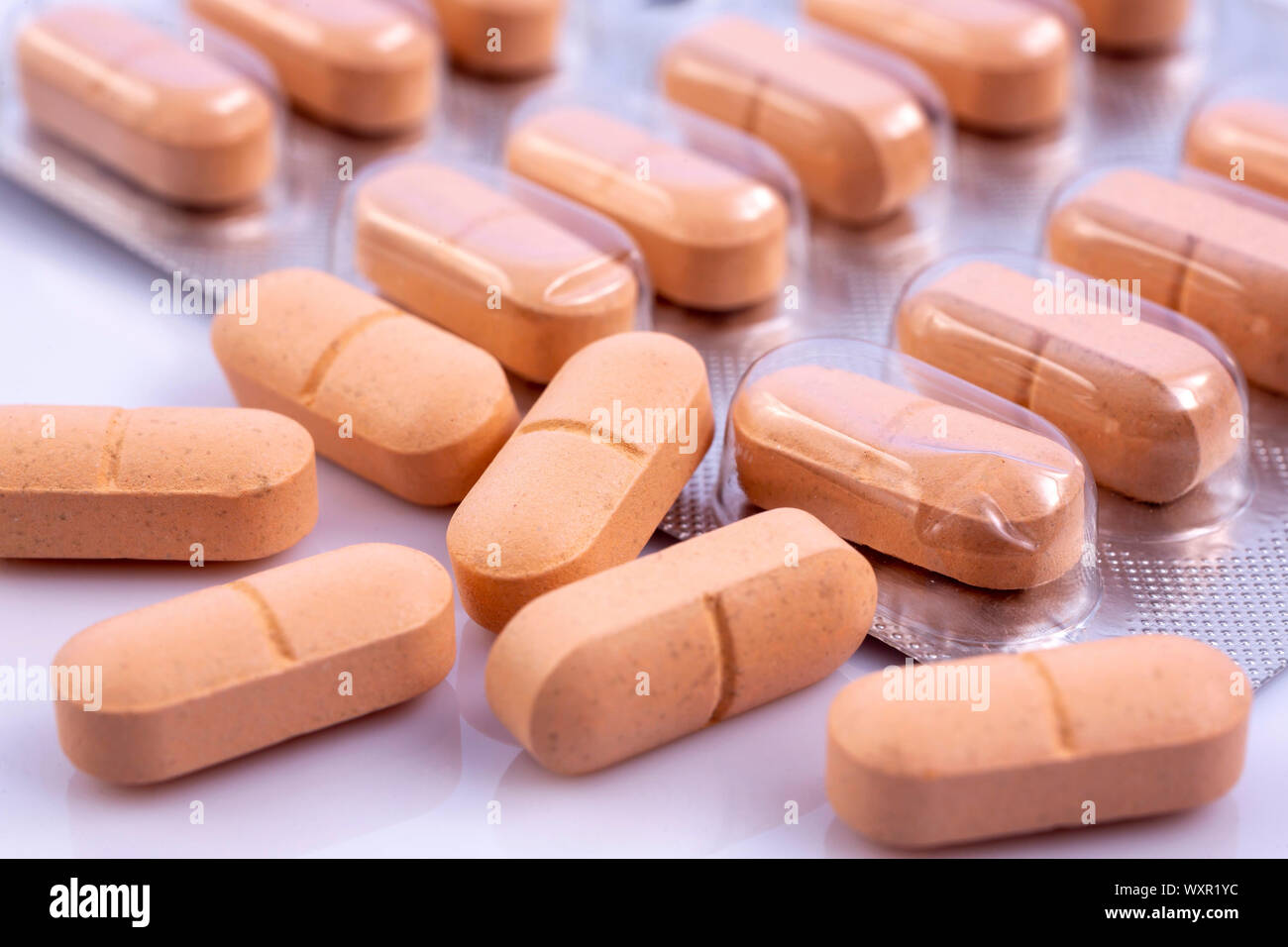 Beige pills in silver plastic pack - blister. Global pharmaceutical ...