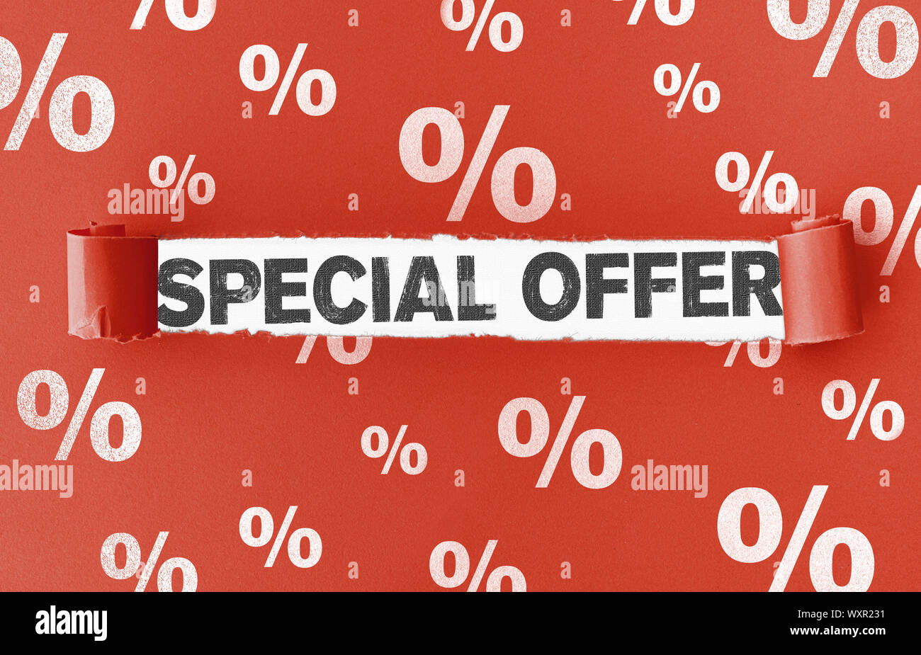 white percent signs on torn red paper with text SPECIAL OFFER in ...