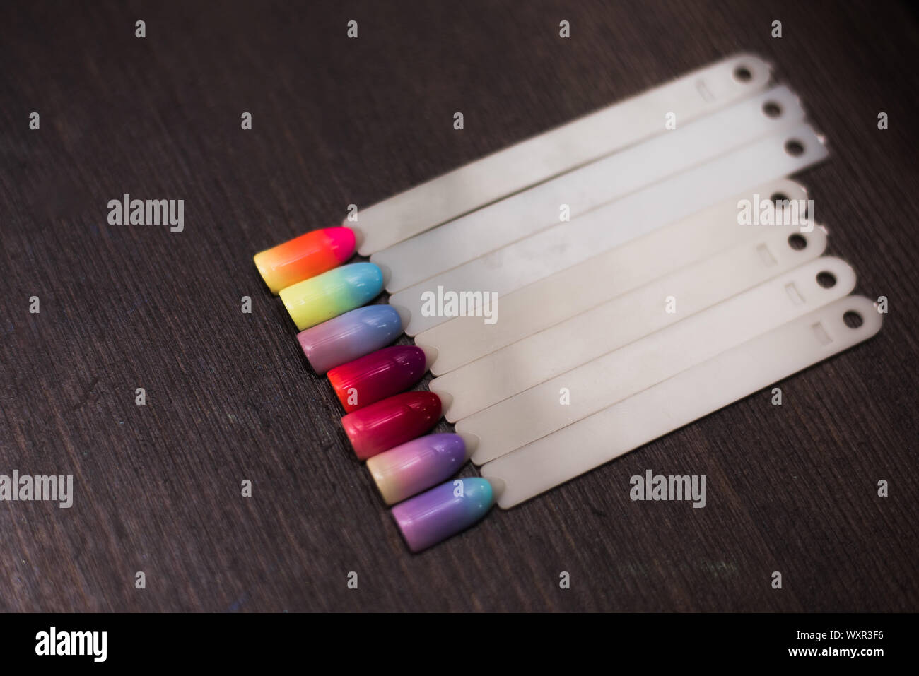 gradient of different colors in a manicure. palette of tips with ...