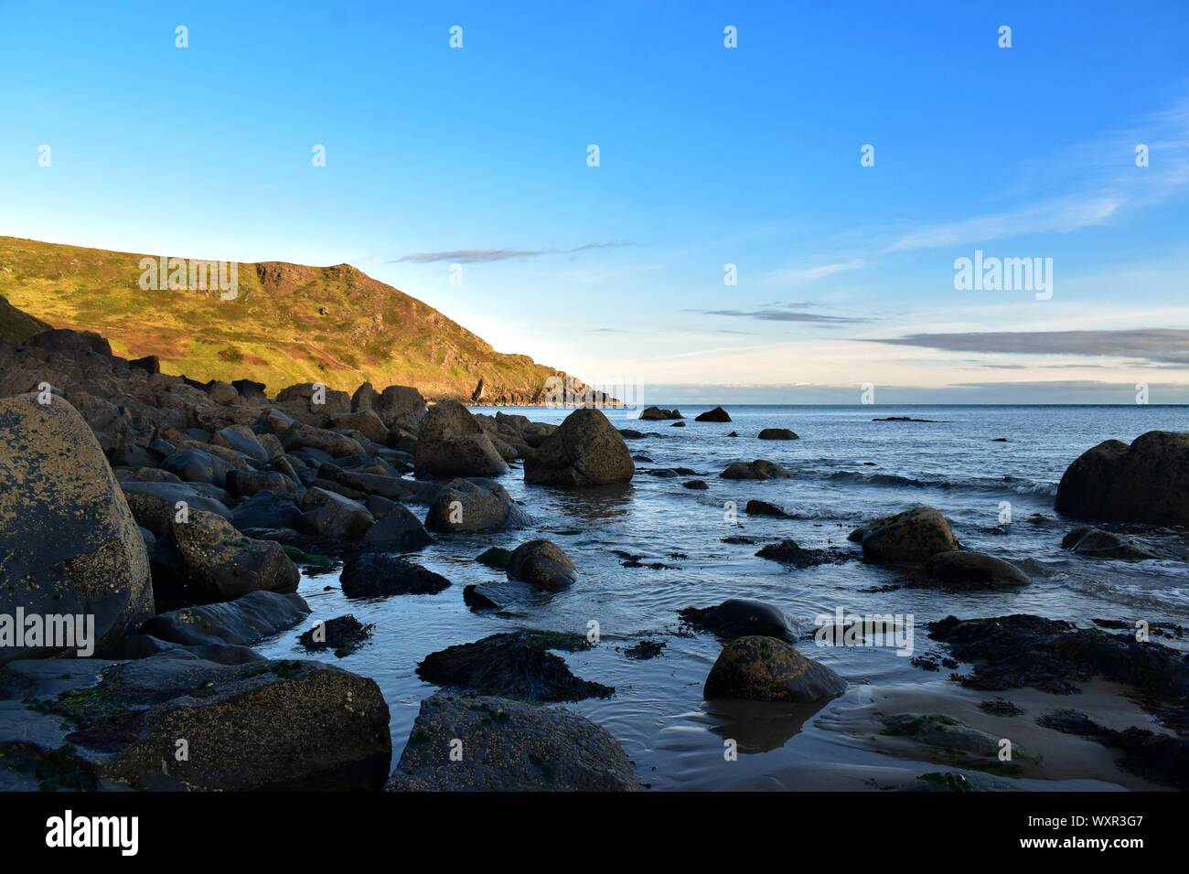 Porth Ysgo Beach looking towards the Trwyn headland Stock Photo - Alamy