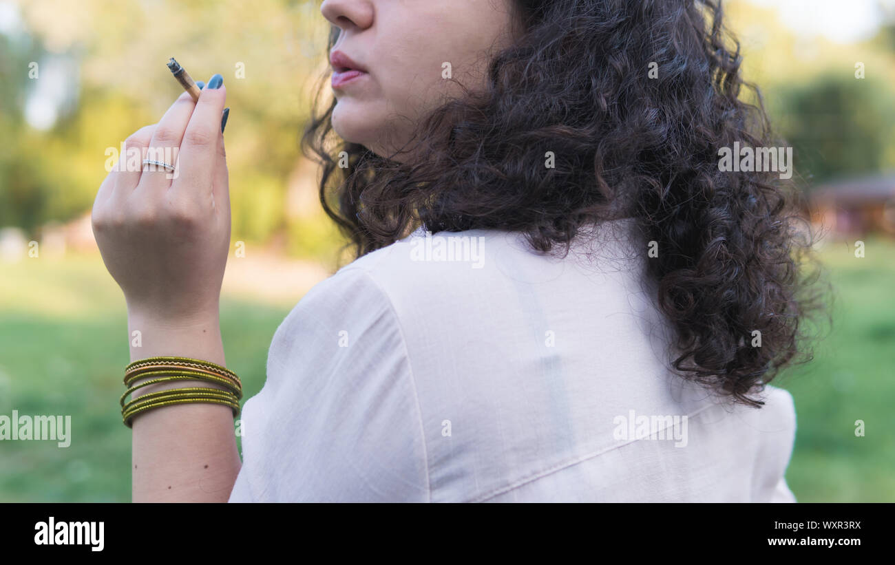 Young woman smoking joint cannabis hi-res stock photography and images ...