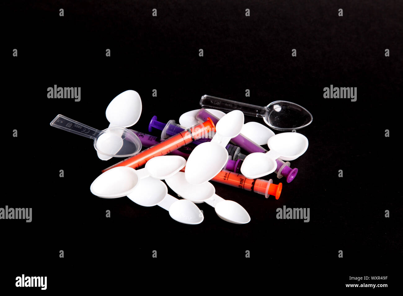 Medicine spoons for babies hi-res stock photography and images - Alamy