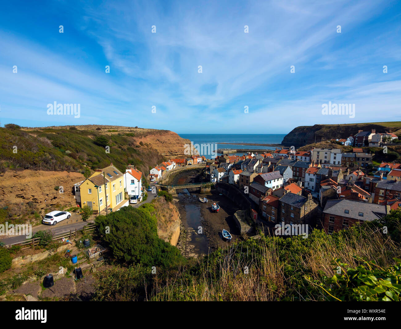 View looking seawards over the harbour of the North Yorkshire Village ...