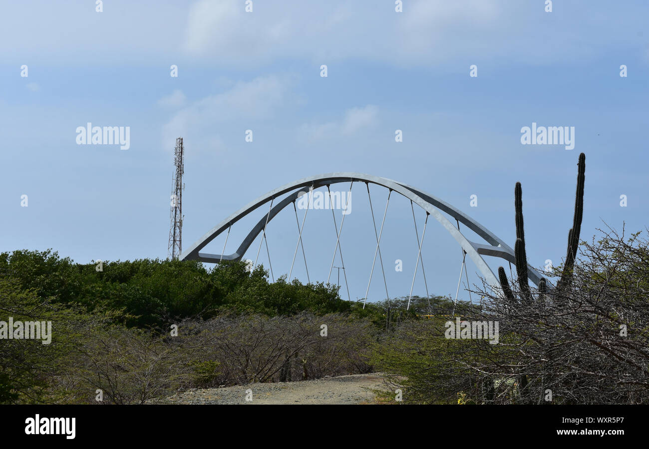 Metal suspension bridge over the Spanish Lagoon in Aruba Stock Photo ...