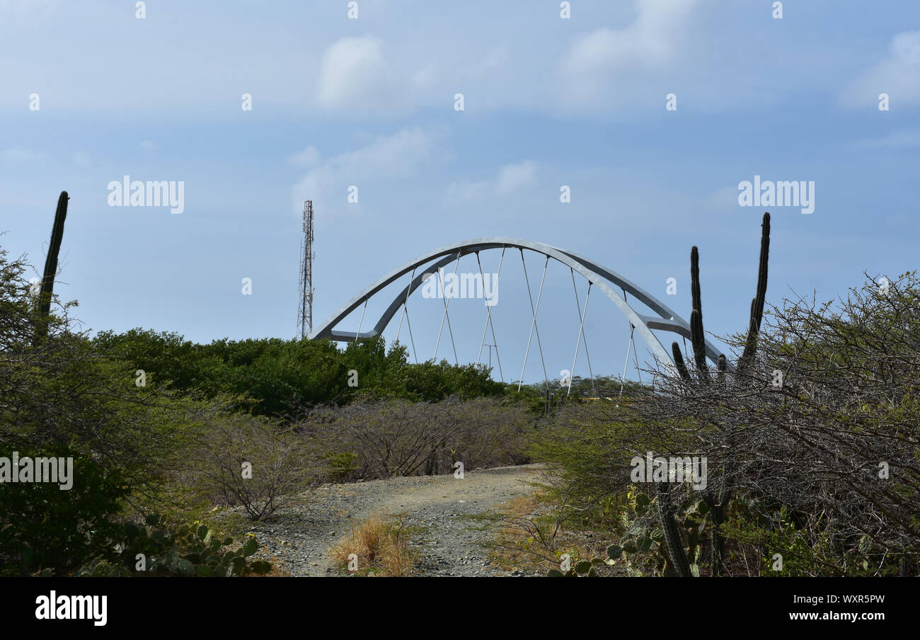 Arch bridge in Aruba extending over the Spanish Lagoon Stock Photo - Alamy