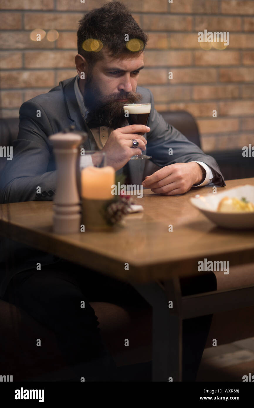 bar customer sit in cafe drinking alcohol. bar party with man drinking ...