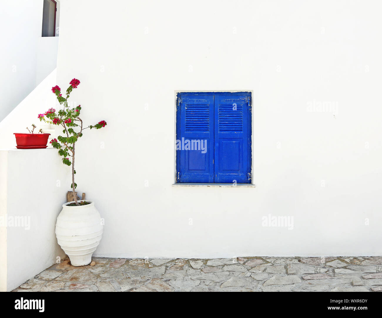 traditional architecture - blue wooden window and bougainvilleas at Ano ...