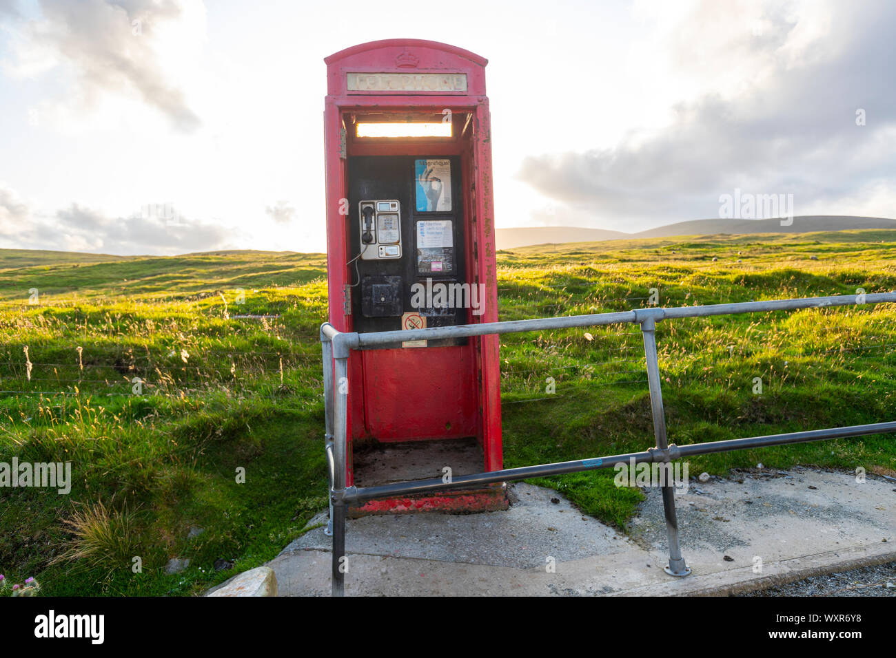 Isolated red telephone box, in North Roe, Mainland, Shetland islands ...