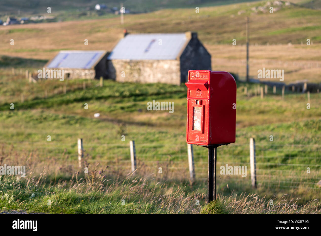 Isolated red mail box in North Roe, Mainland, Shetland islands ...