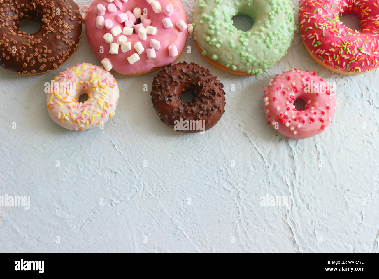 Assorted colorful donuts close-up. Photos of different donuts Stock ...