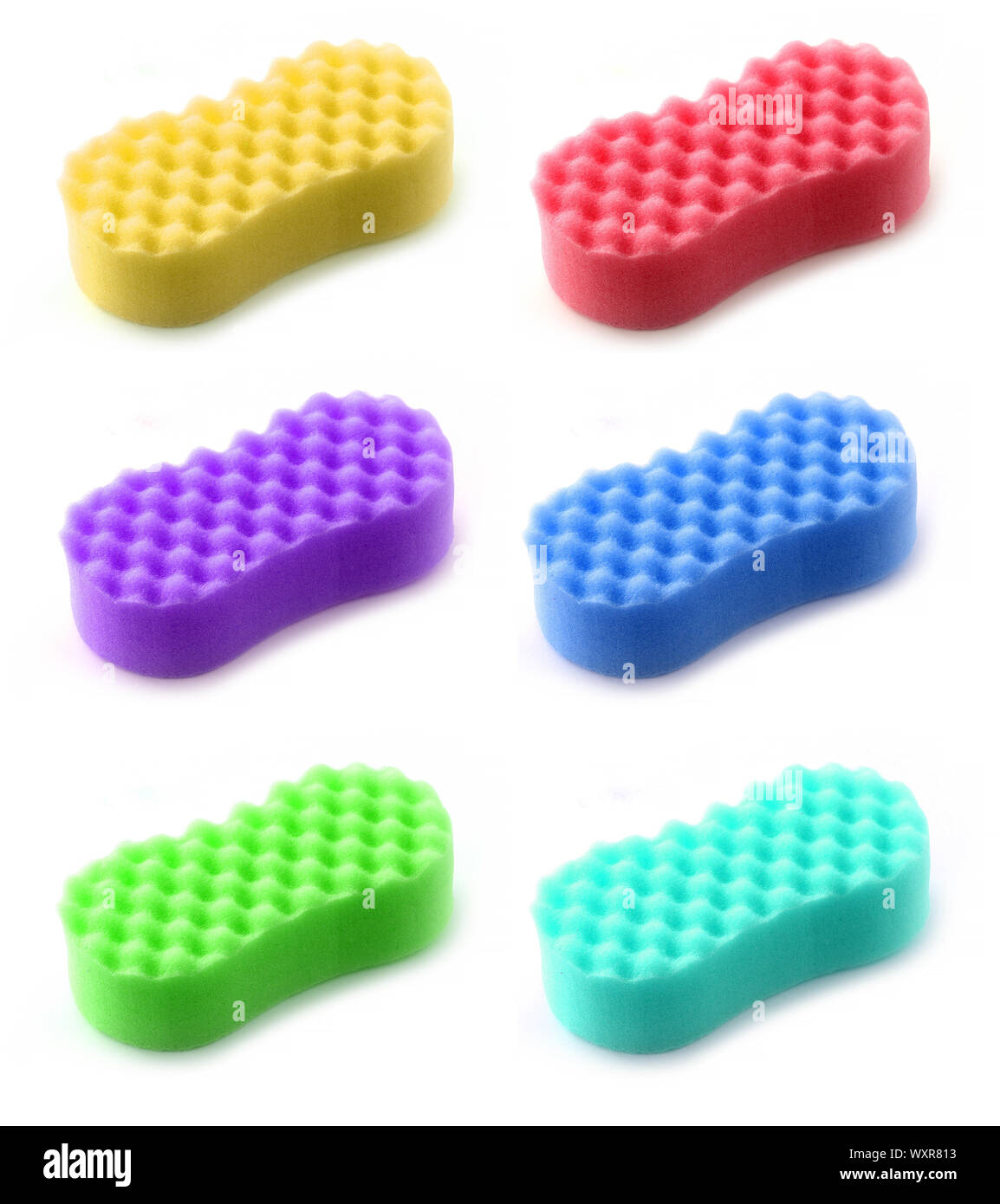 Set of sponges in different colors for washing dishes on a white ...