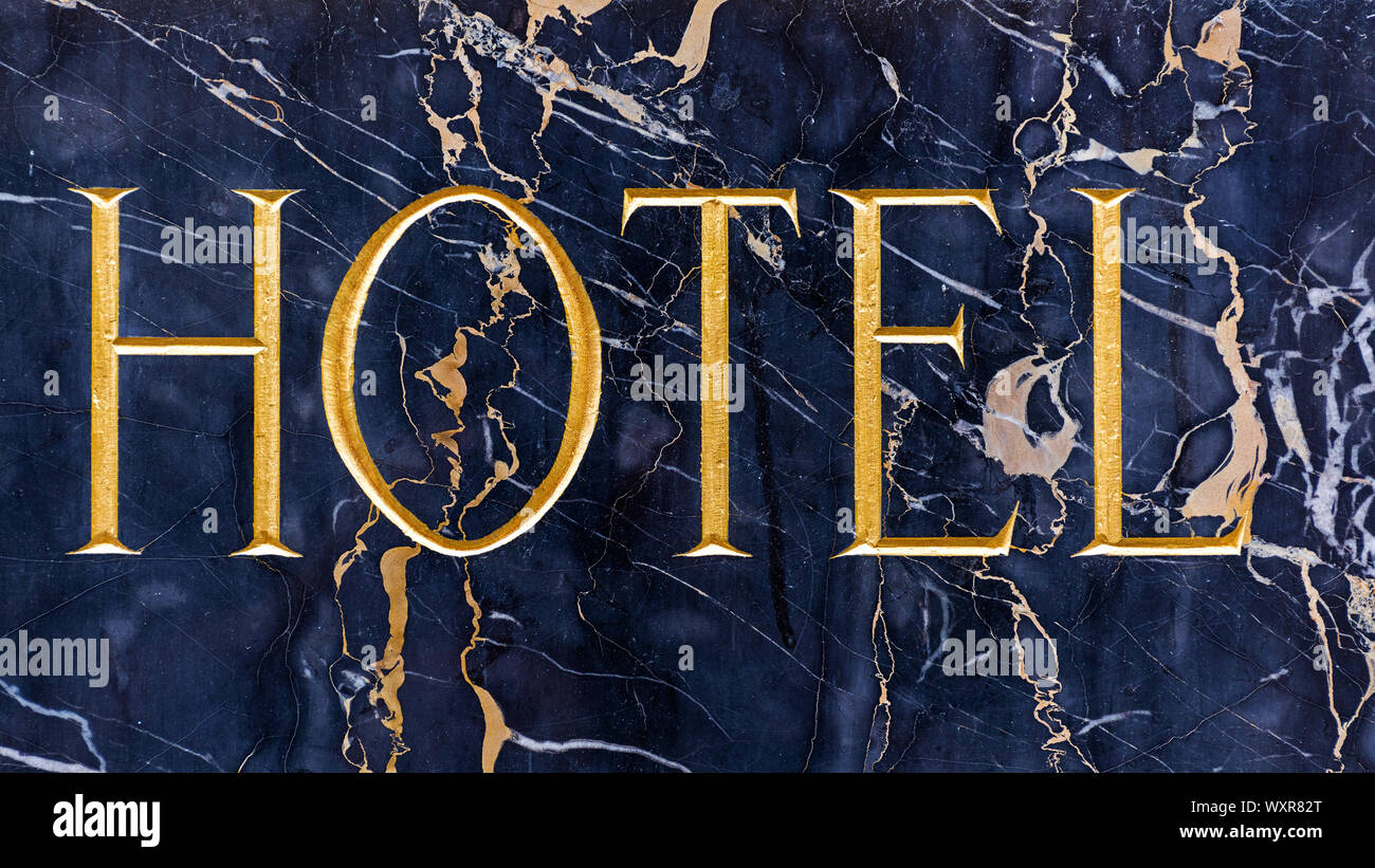 Golden Hotel Sign at Luxurious Marble Stone Stock Photo - Alamy