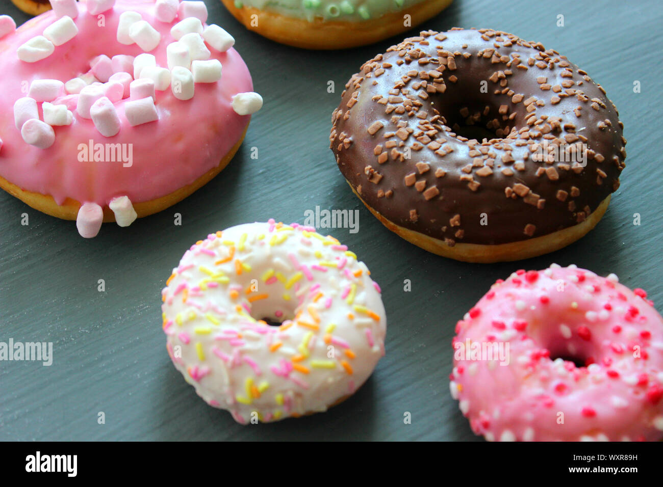 Assorted colorful donuts close-up. Photos of different donuts Stock ...