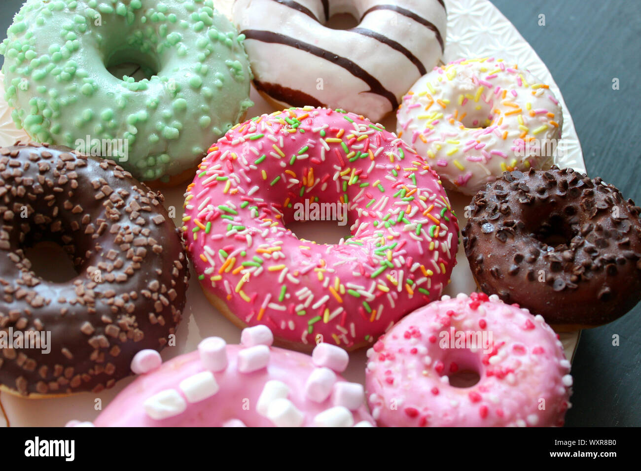 Assorted colorful donuts close-up. Photos of different donuts Stock ...