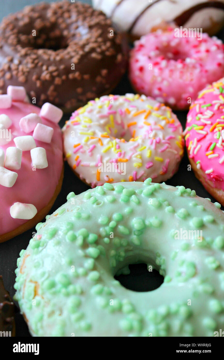 Assorted colorful donuts close-up. Photos of different donuts Stock ...