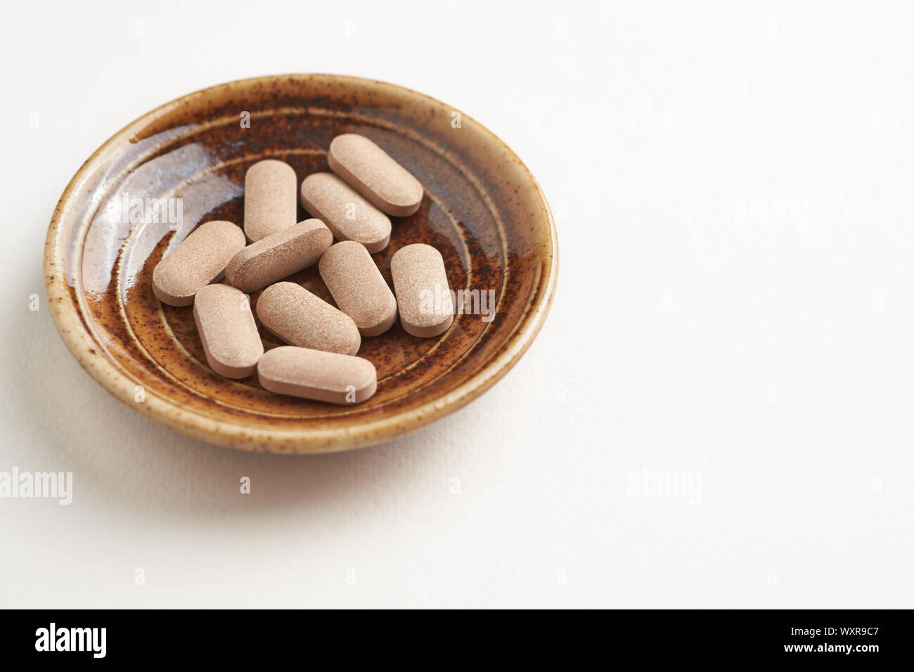 Rhodiola rosea. Golden root, rose root. Herbal pills with healthy ...