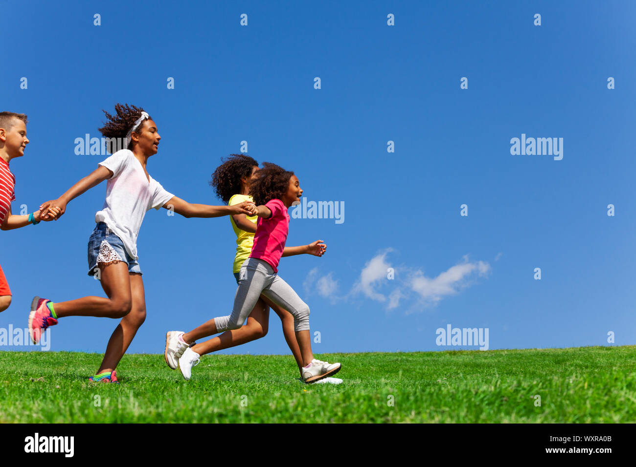 Running kids hi-res stock photography and images - Alamy